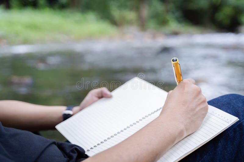 Cropped Image of Man Writing in Notebook Ideas and Enjoying Nature in ...