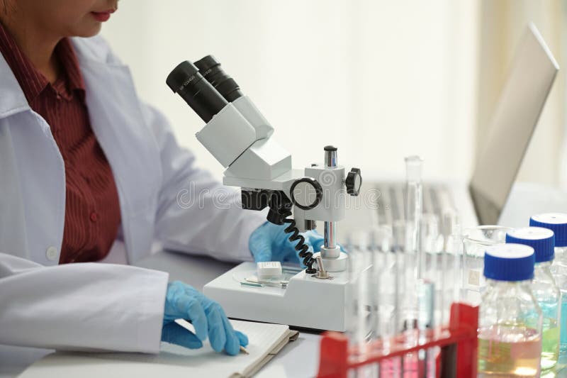 Pharmaceutical Scientist Working with Microscope Stock Photo - Image of ...