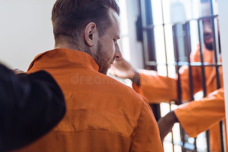 Multicultural Prisoners Standing Near Prison Bars Stock Photo - Image ...