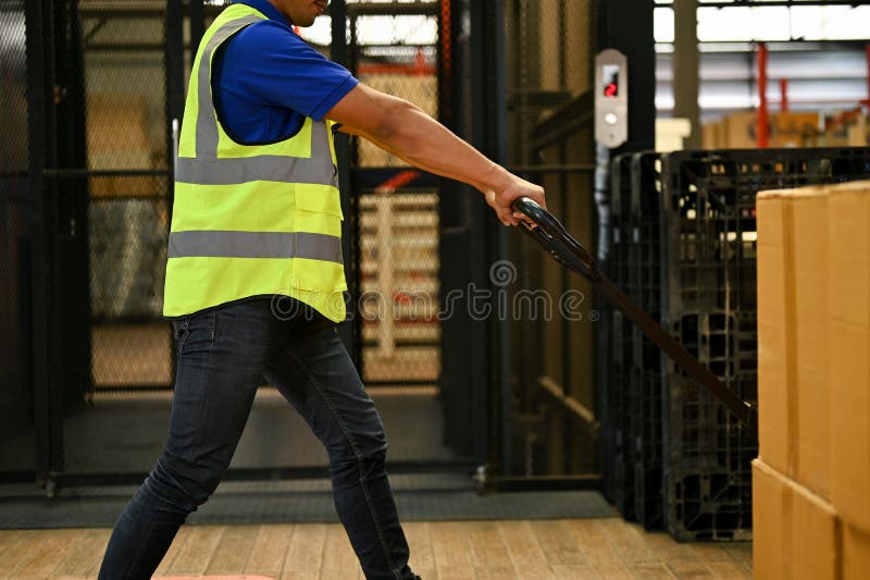 Cropped, Professional Asian Man Warehouse Worker Pulling a Pallet Truck ...