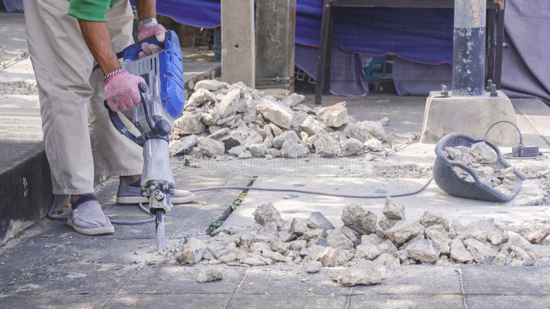 Road Worker Using Jackhammer Drilling Footpath on Roadside Area for ...