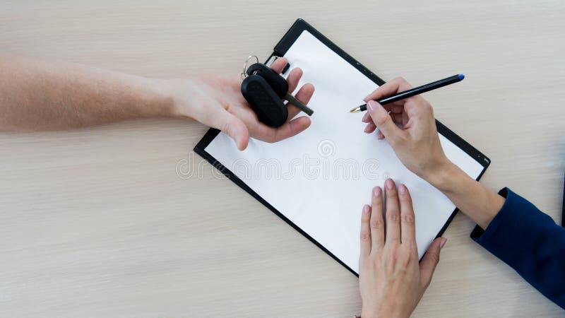 Cropped Image of Sales Manager and Customer Signing Documents about ...