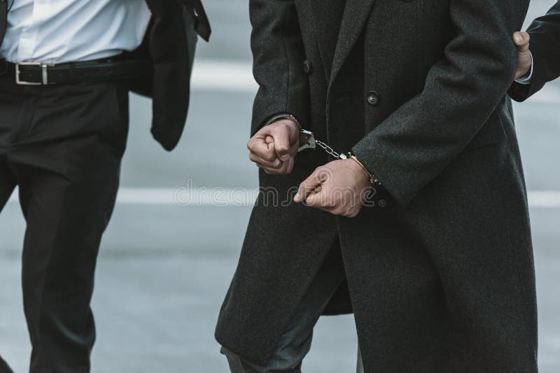 Cropped Image of Security Guard Holding Man Stock Image - Image of ...