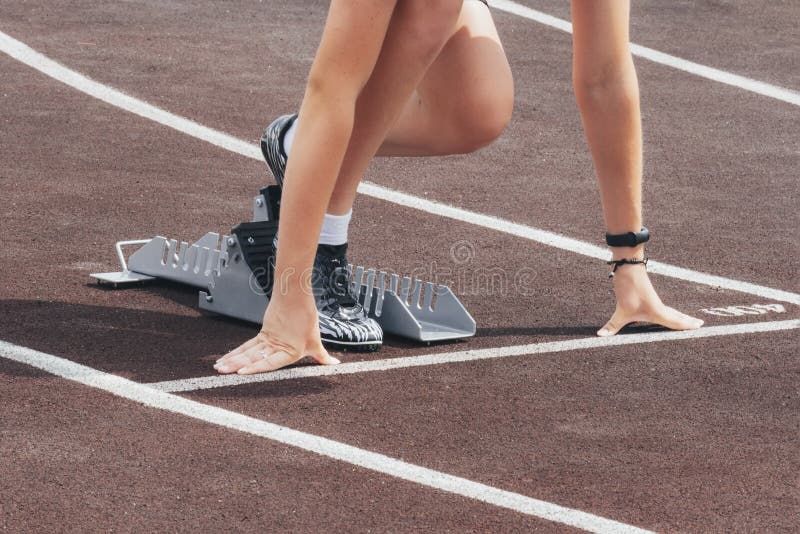 Cropped Image of a Sprinter Getting Ready To Start at Stadium Stock ... Cropped Image of a Sprinter Getting Ready To Start at Stadium Stock ...