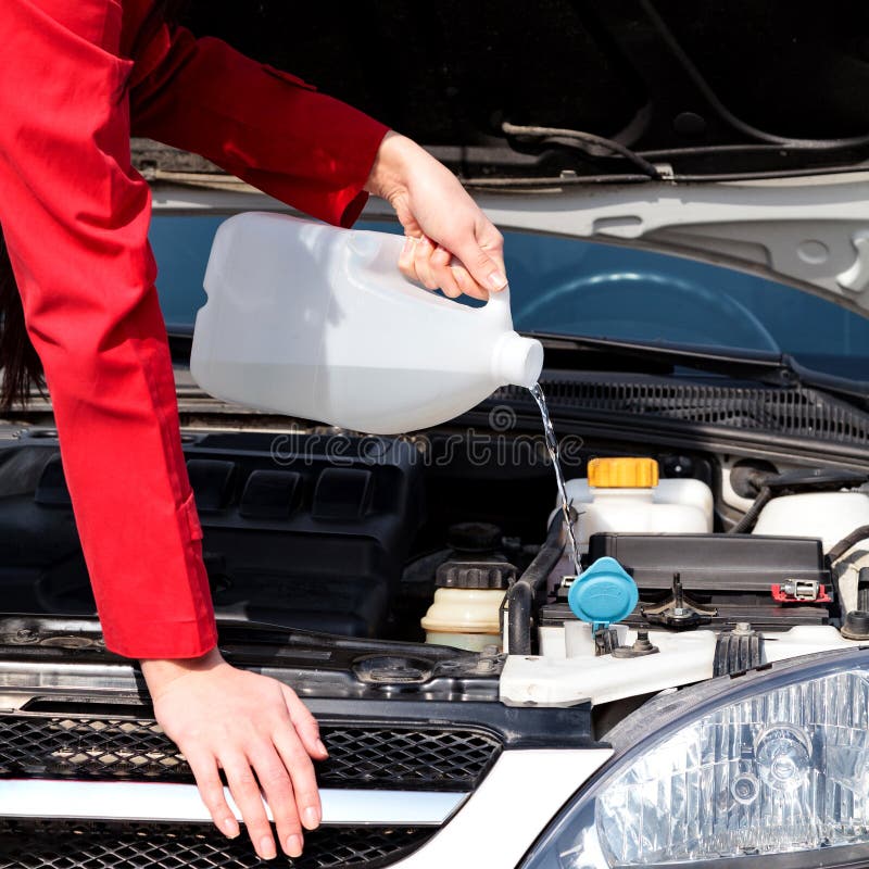 Cropped Image of Woman Pouring Windshield Washer Fluid Stock Photo ...