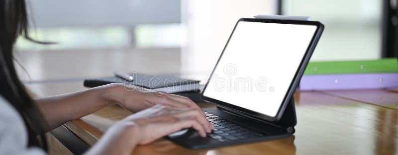 A Cropped Image of a Woman`s Hand is Using a Computer Tablet at the ...
