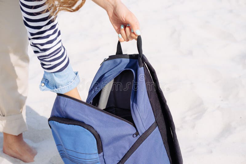 Cropped Image: Woman S Hands Opened the Blue Backpack and Pulled Stock ...