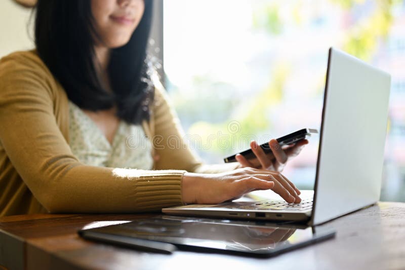 Cropped Image, a Young Asian Woman Using Laptop, Working on Her Project ...