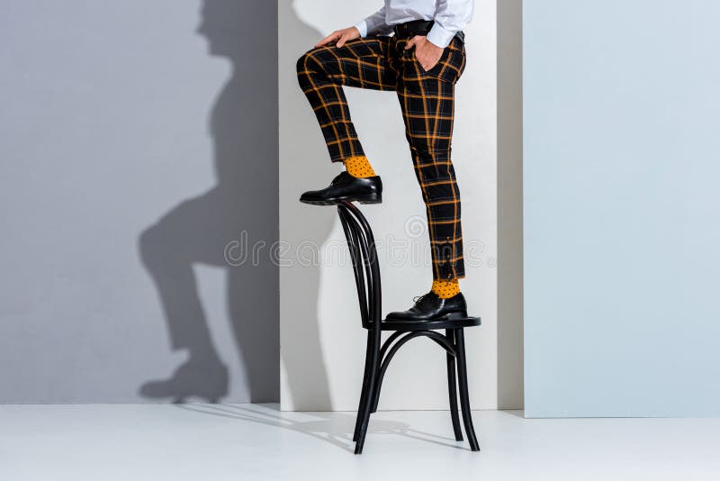 Cropped of Man Standing on Chair Stock Photo - Image of stripes ...