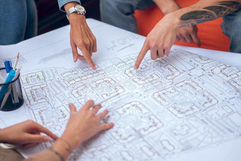 Team of Draftspeople Involved in Work on a Technical Drawing Stock ...