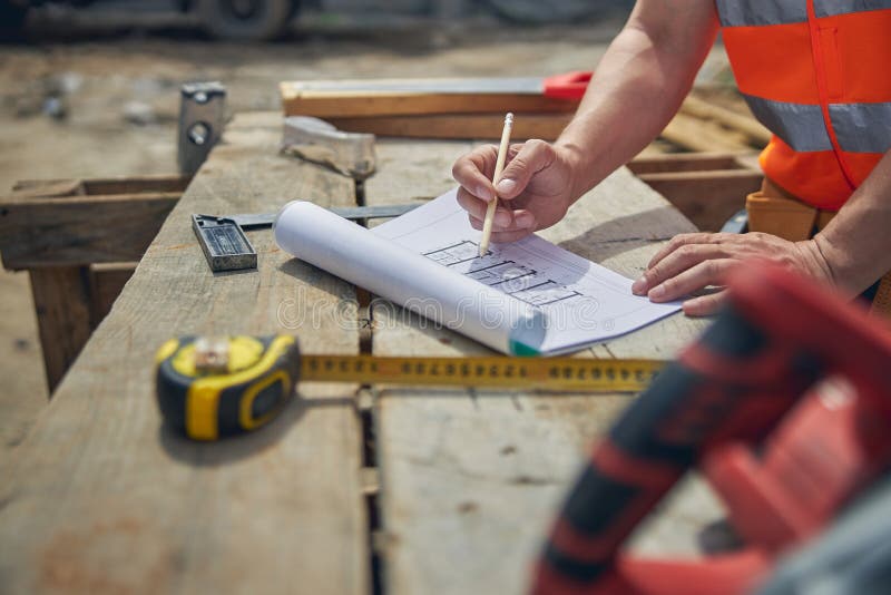 Caucasian Male Constructor Drawing with a Pencil Stock Image - Image of ...