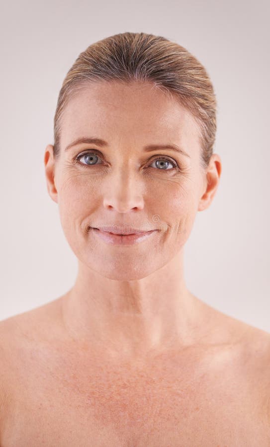 Maturing Beauty Cropped Portrait Of A Beautiful Mature Woman Posing In