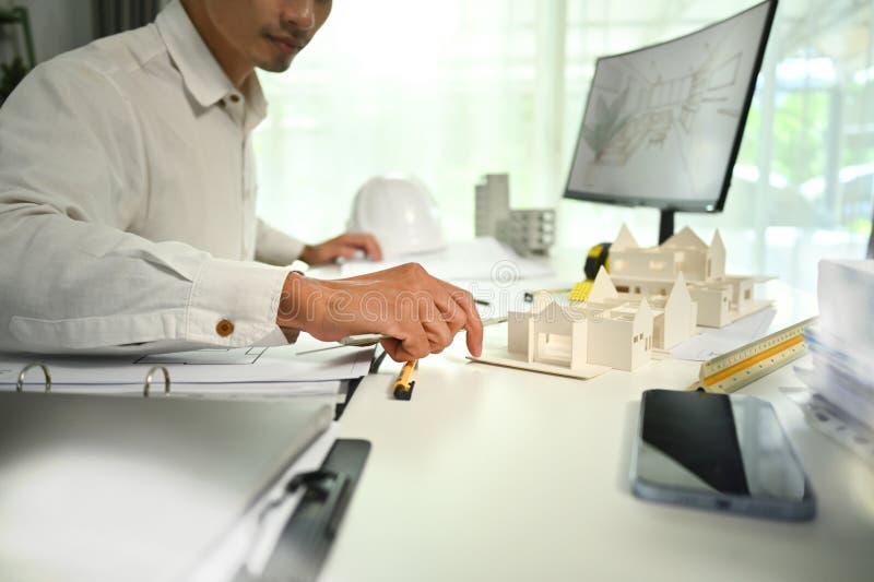 Cropped Shot of Architect Man Examining Building Model, Working on ...