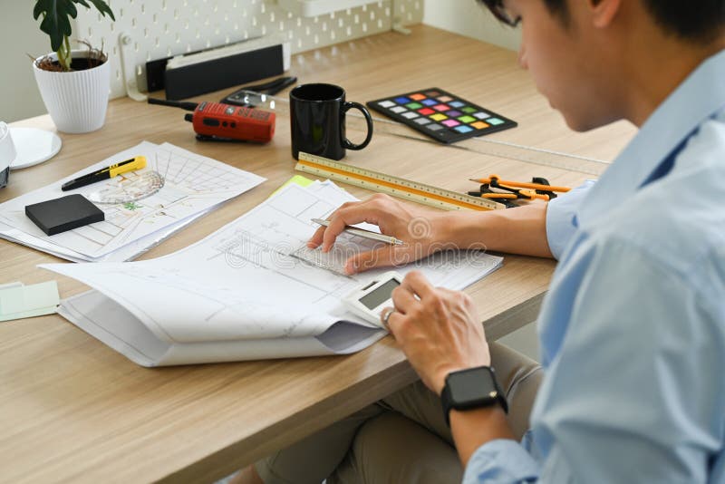 Cropped Shot of Architect Man Using Calculator and Working on ...