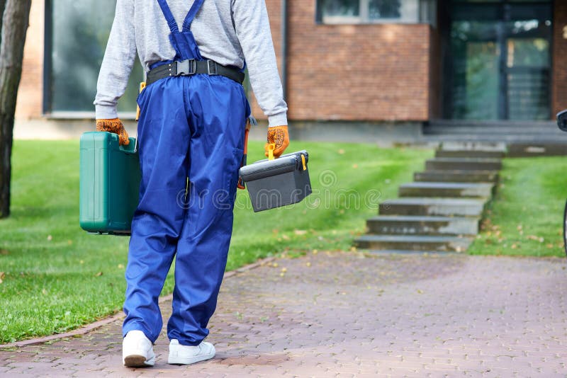 Cropped Shot of Builder Carrying Toolbox at Cottage Construction Site ...