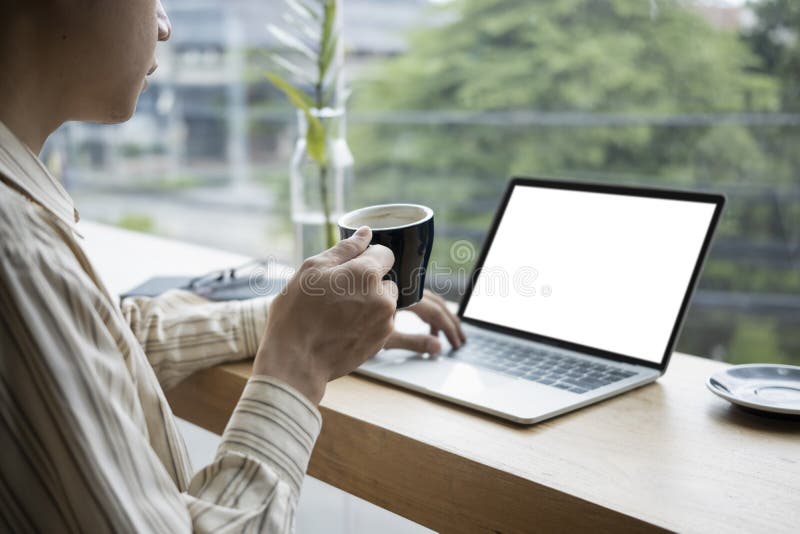 Businessman Holding Coffee Cup and Working with Laptop Computer. Stock ...