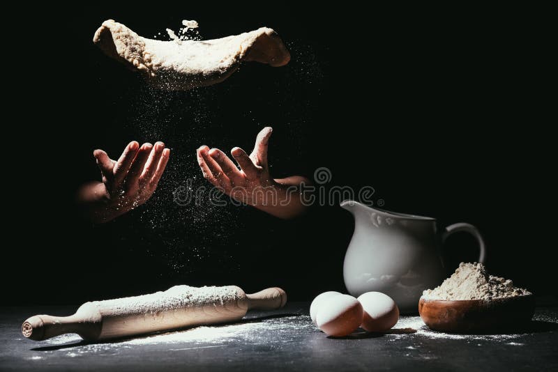 Cropped Shot of Chef Throwing Up Dough for Pizza Stock Photo - Image of ...