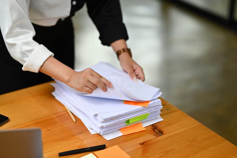 Cropped Shot of Female Employee Woman Working on Stack Documents at Her ...
