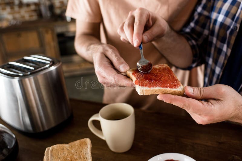 Cropped Shot of Men Preparing Toast with Jam for Breakfast Stock Image ...