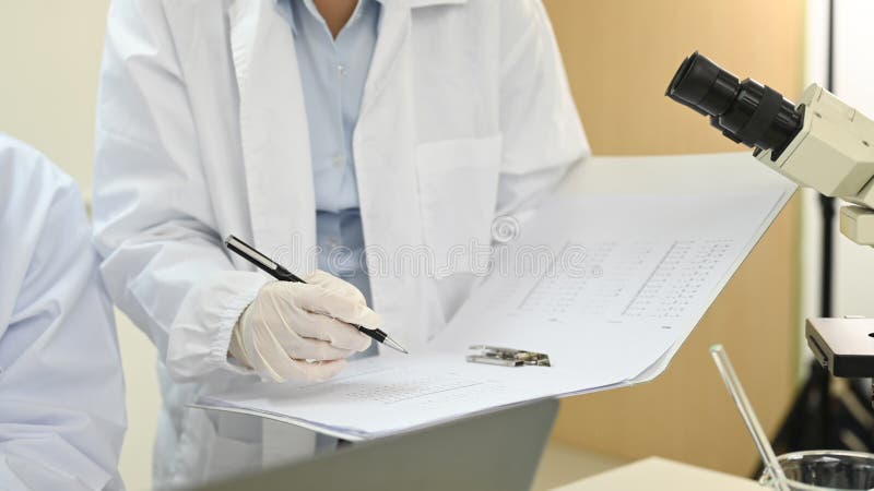 Cropped Shot of Scientist Analyzing and Summarising Information for ...
