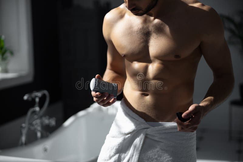 Cropped Shot of Young Handsome Man Applying Deodorant Stock Image ...