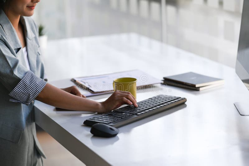 Young Woman Employee Working on Computer while Sitting at Comfortable ...