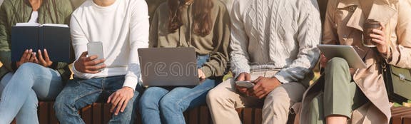 Cropped of Students Studying Outdoors, Using Gadgets Stock Photo ...