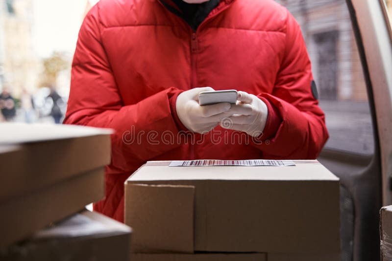 Man Holding Smartphone while Making Delivery Stock Photo - Image of ...