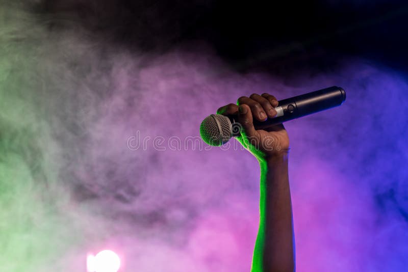 Cropped View of Hand Holding Microphone in Nightclub Stock Image ...