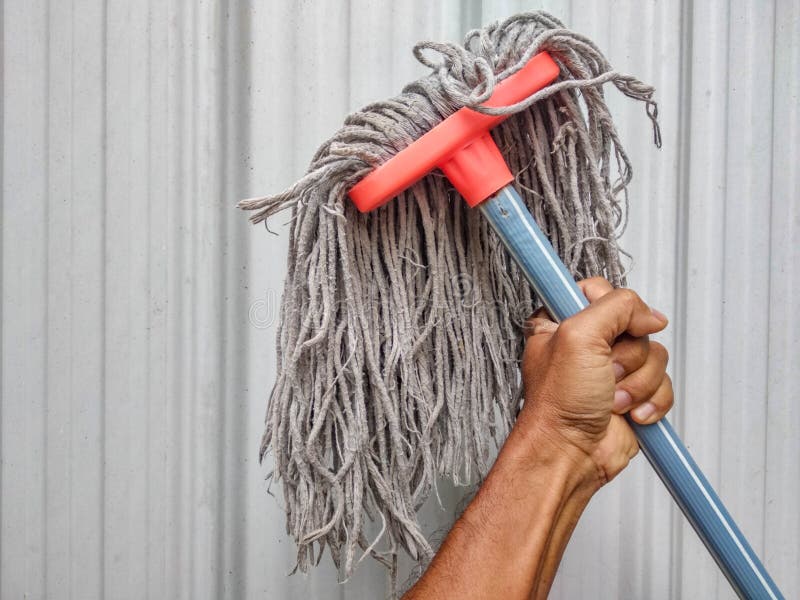 Hand holding mop stock photo. Image of cleaning, chores - 342898056