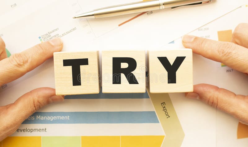 Cropped View of Hands Holding Wooden Cubes with TRY Lettering on Work ...