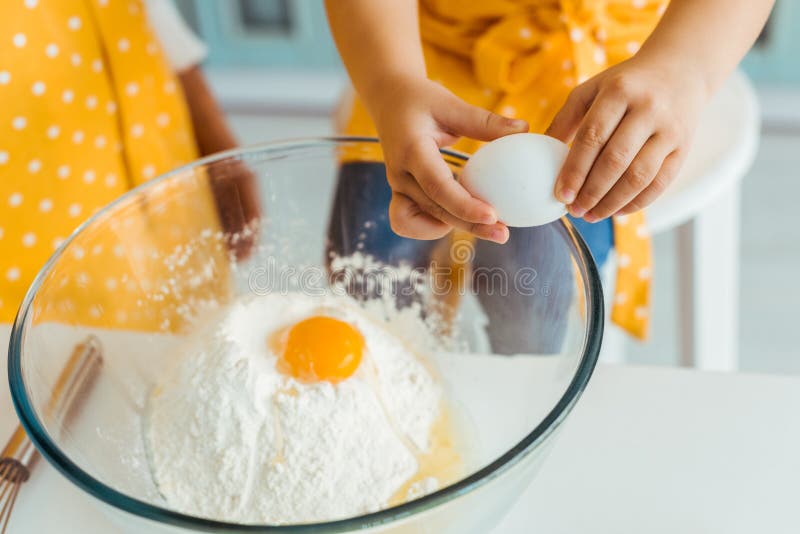 View of Kid Adding Eggs To Flour in Glass Bowl Stock Image - Image of ...