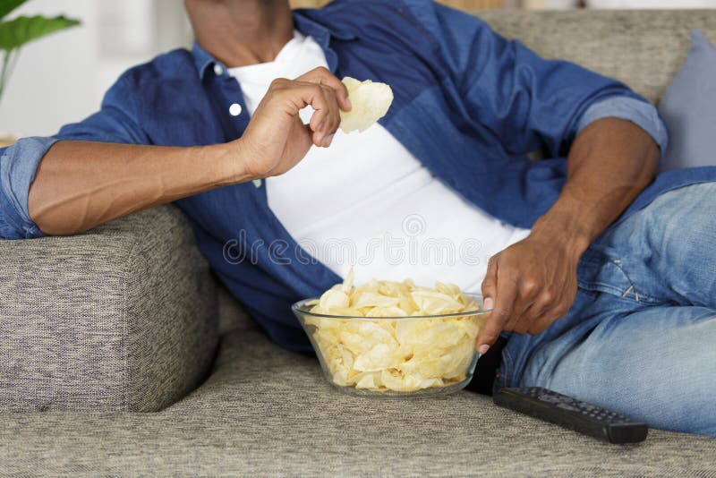 Cropped View Man Eating Snacks while Watching Tv Stock Image - Image of ...