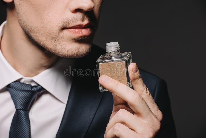 Cropped View of Man Smelling Perfume Isolated Stock Photo - Image of ...