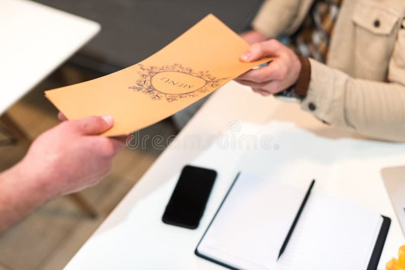 Cropped View of Man and Waiter Holding Menu Stock Photo - Image of ...