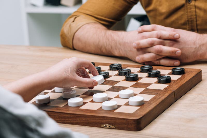 Cropped View of Man and Woman Playing Checkers Stock Photo - Image of ...