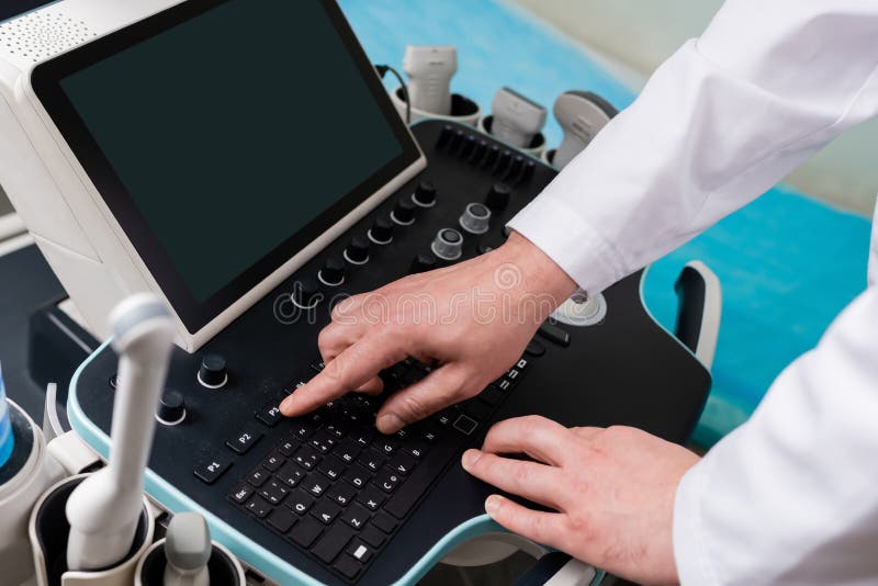 Cropped View of Physician Using Control Stock Photo - Image of ... Cropped View of Physician Using Control Stock Photo - Image of ...