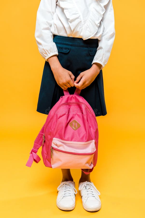 Cropped View of Schoolkid Holding Backpack and Standing on Orange ...