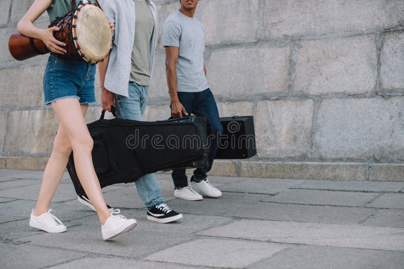 Cropped View of Young People in Band Walking and Carrying Stock Image ...