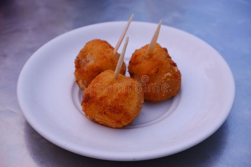 Croquette in a round plate stock photo. Image of toothpick - 217738544