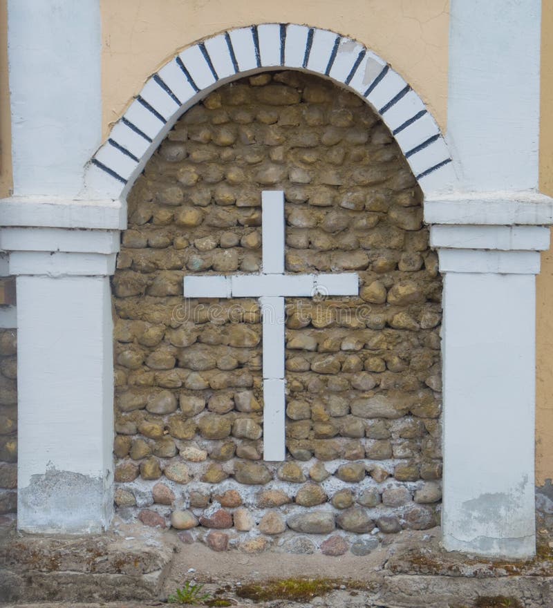 The Cross of Bricks in the Wall of the Church. Stock Photo - Image of ...