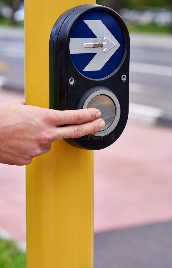 Cross with Care. a Mans Hand Pressing the Crossing Button at an ...