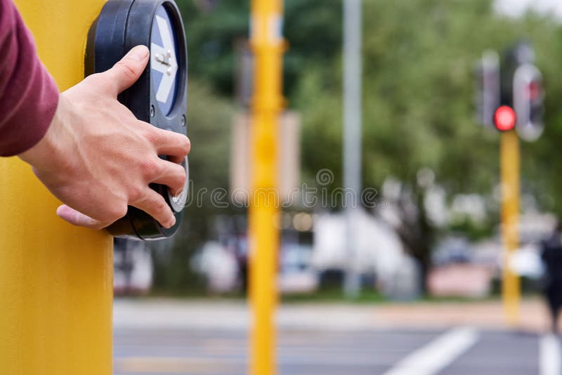 Always Cross with Care. a Mans Hand Pressing the Crossing Button at an ...