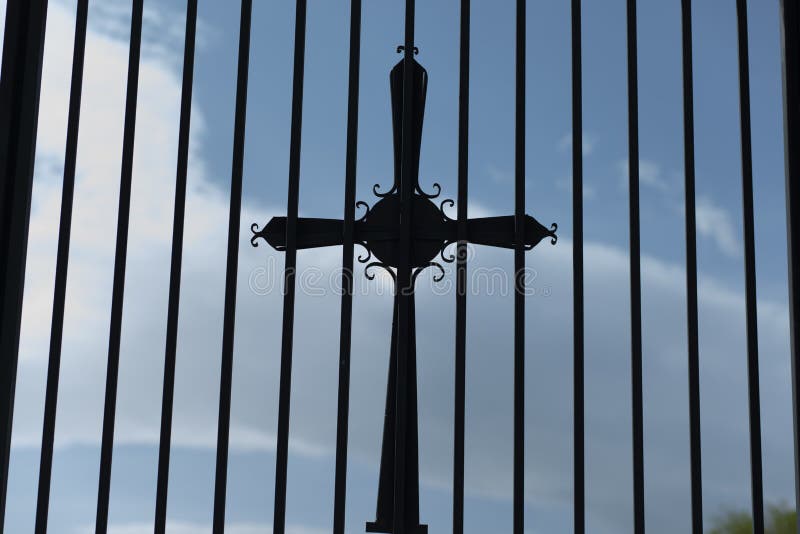 Cross in the gate stock photo. Image of exterior, graveyard - 183317294