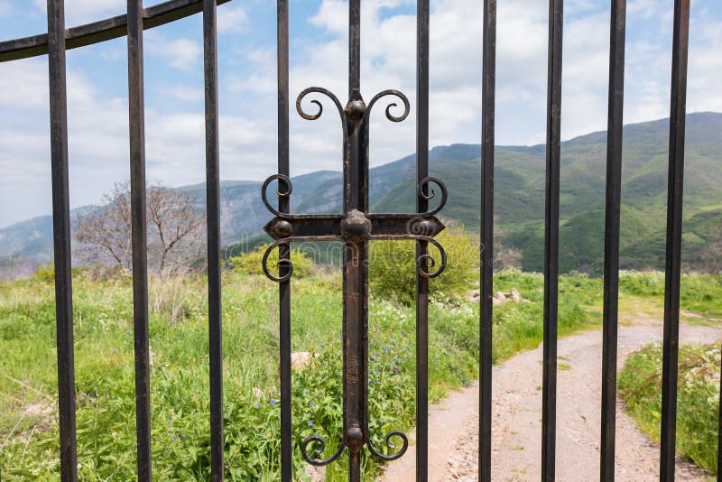 Cross in the gate stock photo. Image of exterior, graveyard - 183317294
