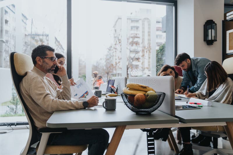 Multi Generational Coworkers Strategizing for Business Growth ...