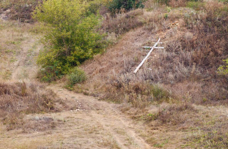 A Cross is on the Ground in a Field Stock Photo - Image of hill, season ...
