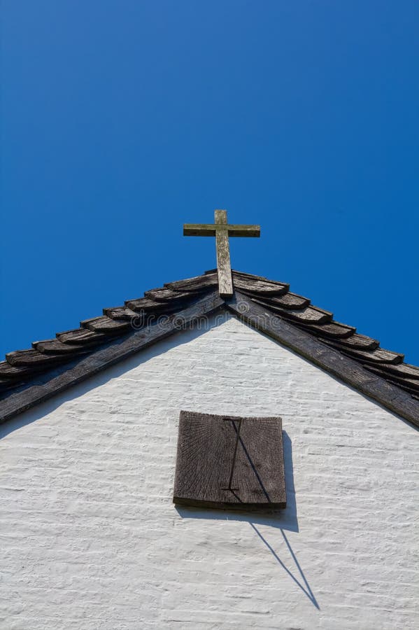 Cross on Top of Gable of Church Roof on Blue Sky Background at ...