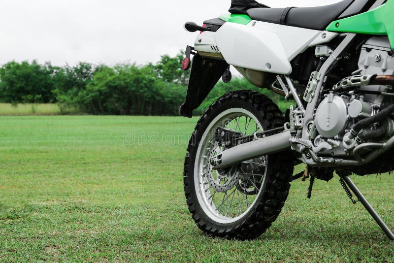 Cross Motorcycle on Green Grass Outdoors, Closeup. Space for Text Stock ...