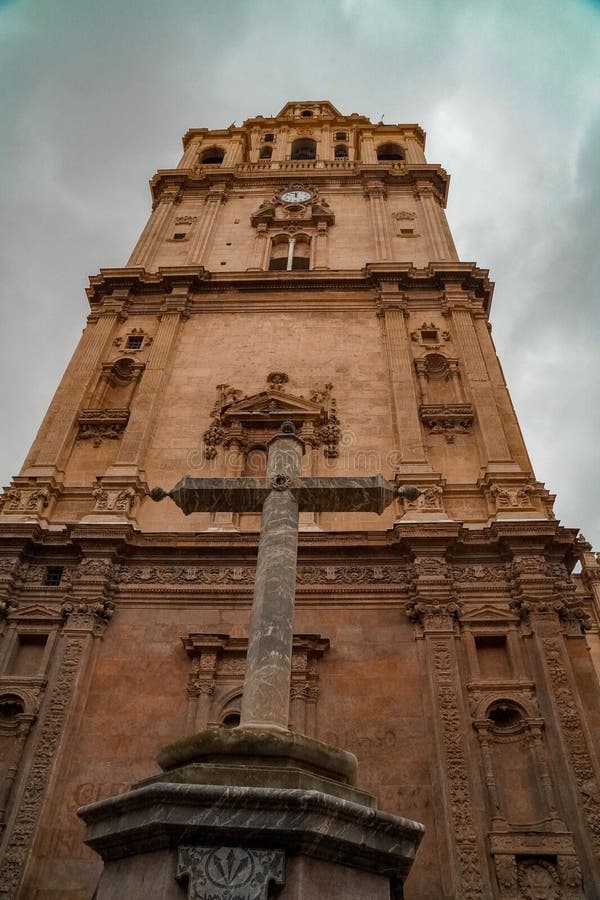 Cross next to a facade stock photo. Image of garden - 377468012